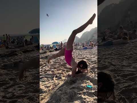 Doing gymnastics in the beach part one
