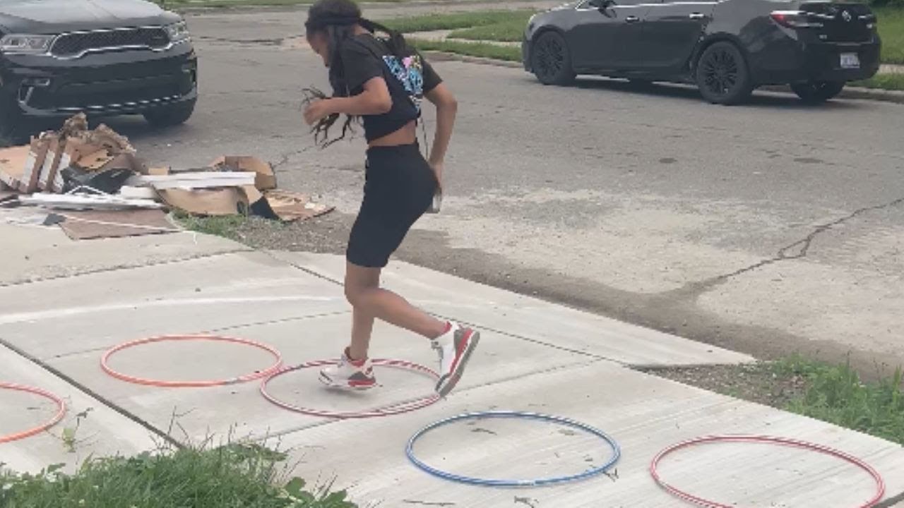 Teenagers play classic rock paper scissor game with a fun outdoor twist ...