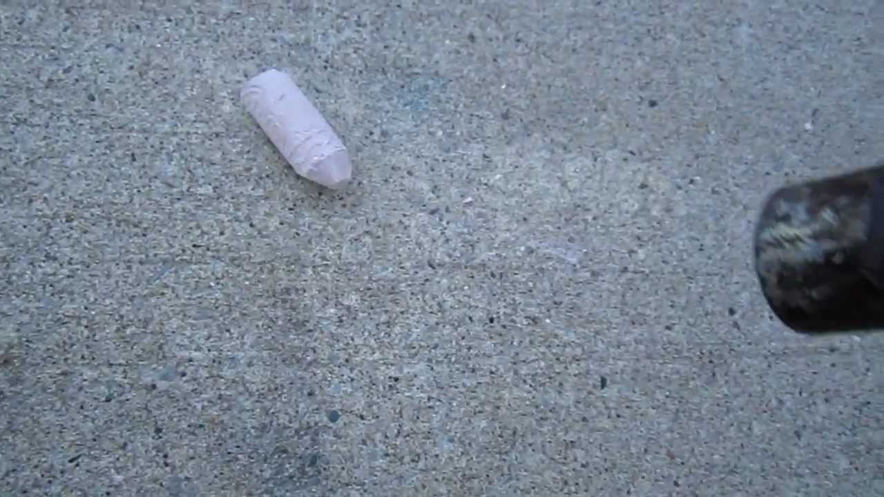 Hitting a piece of purple chalk with a hammer - YouTube