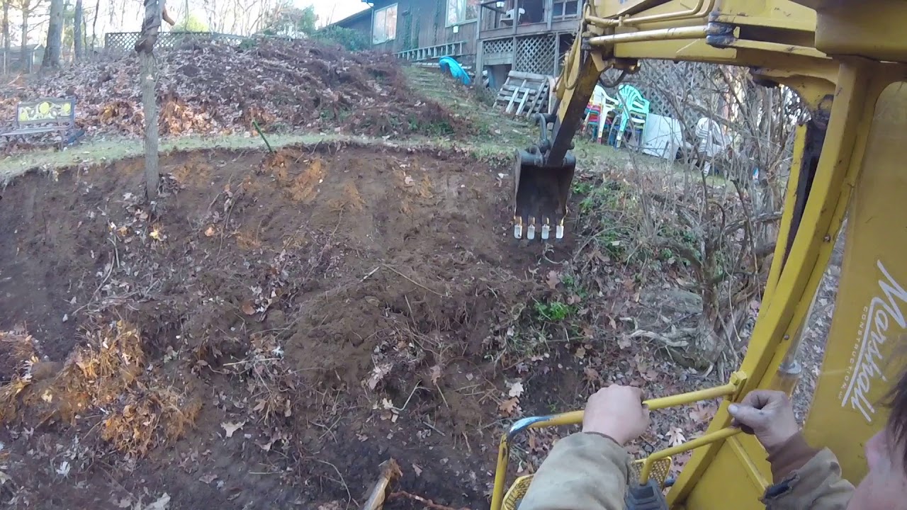 komatsu mini excavator cutting a slope - YouTube