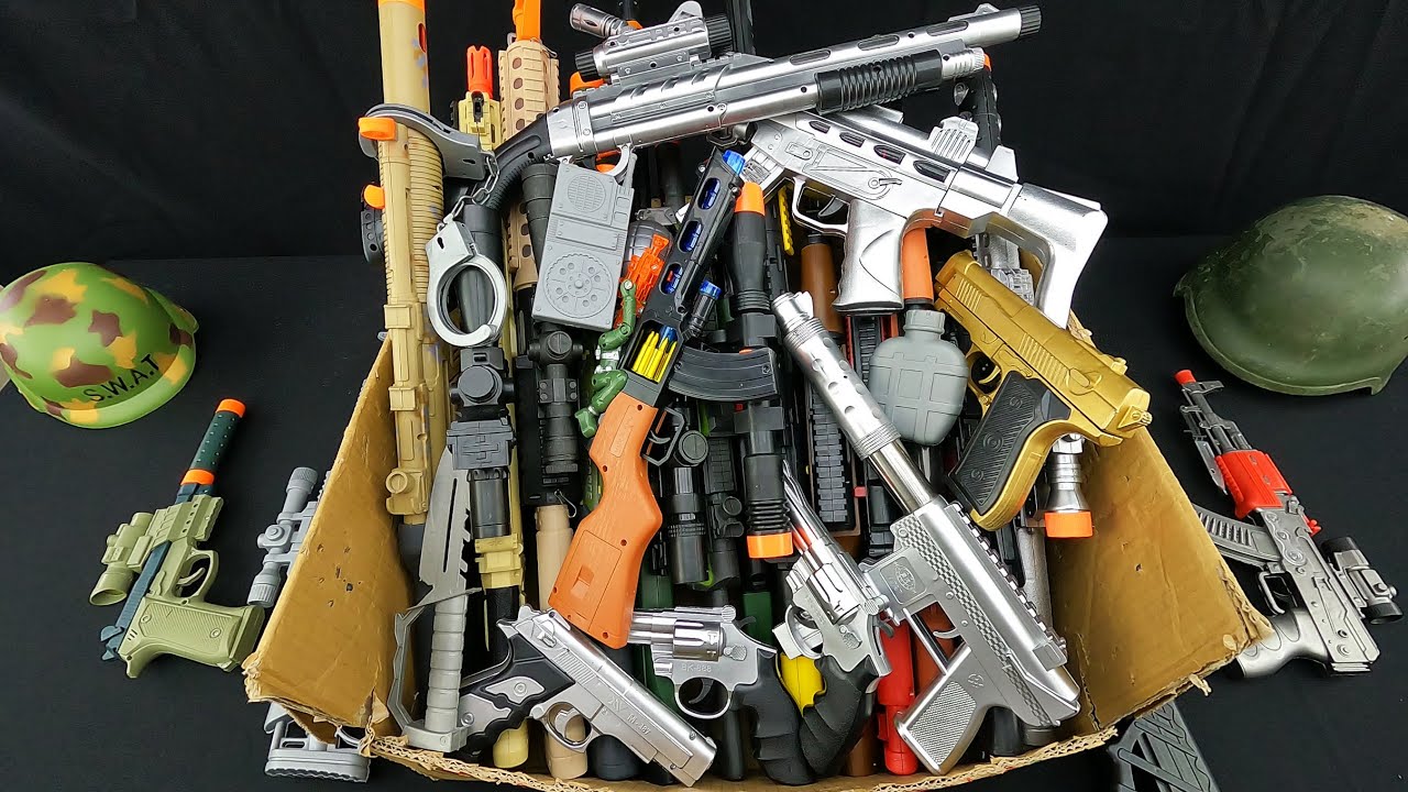 Box of Toy Guns, Gray Tec-9 Gun, Special Army Rifles, and Other ...
