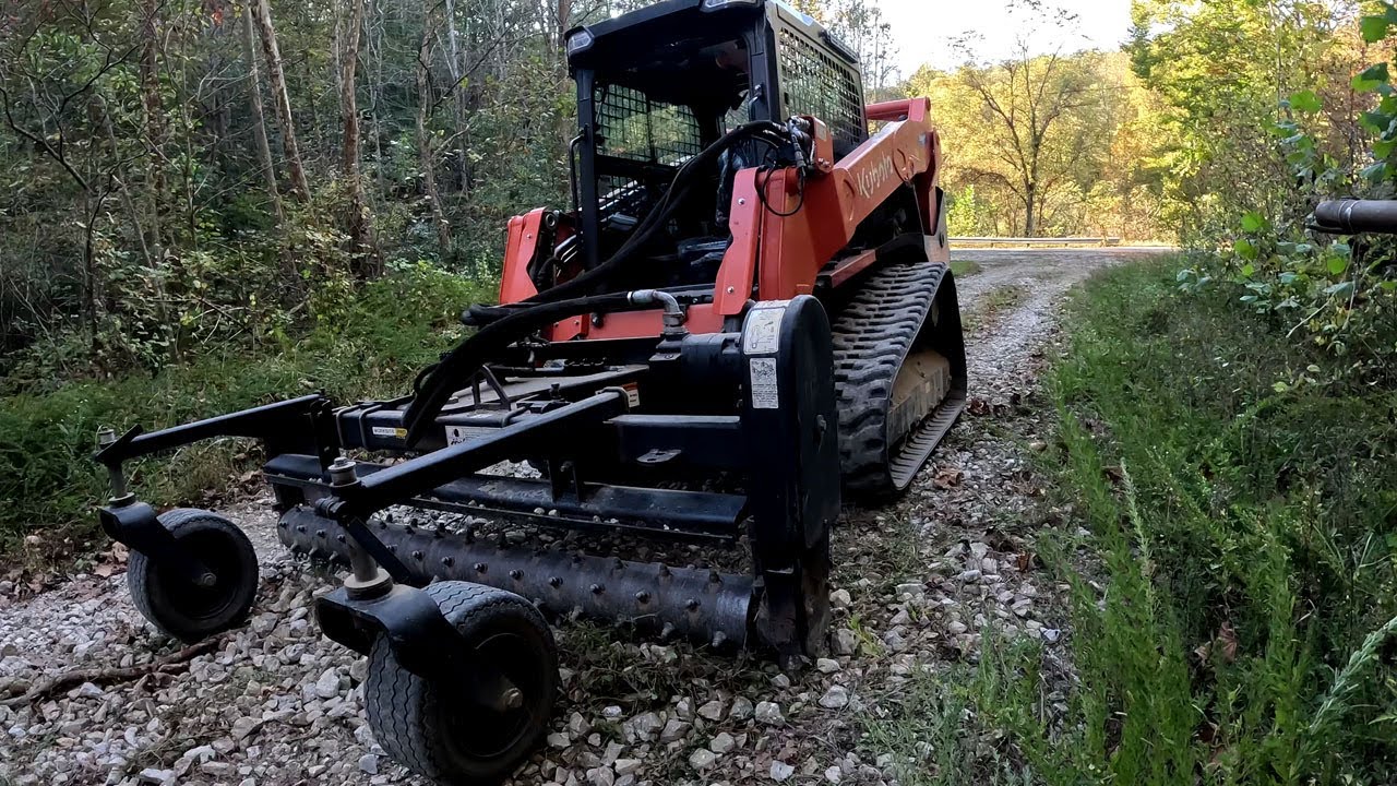 Fixing Washed Out Gravel Drive with Skid Steer Power Rake - YouTube