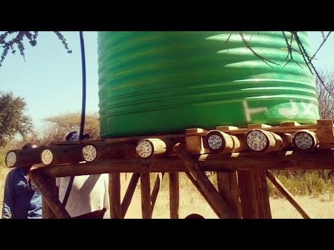 Making a stand for our 5000 ltr Jojo tank with gumpoles - YouTube