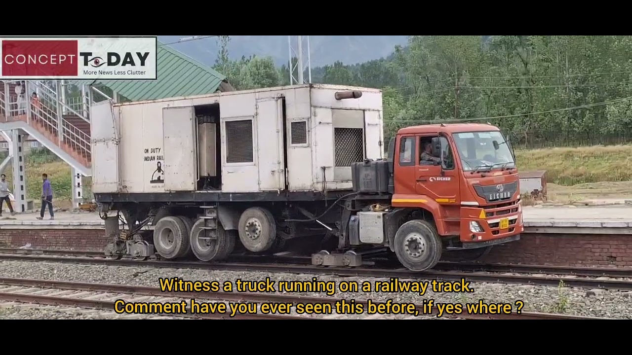 Trucks can drive on the train tracks. These utility vehicles are ...