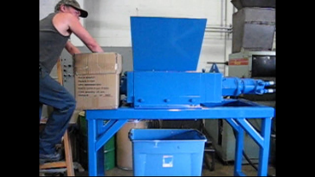 Chipper shredder shredding coat plastic coat hangers with steel hooks ...