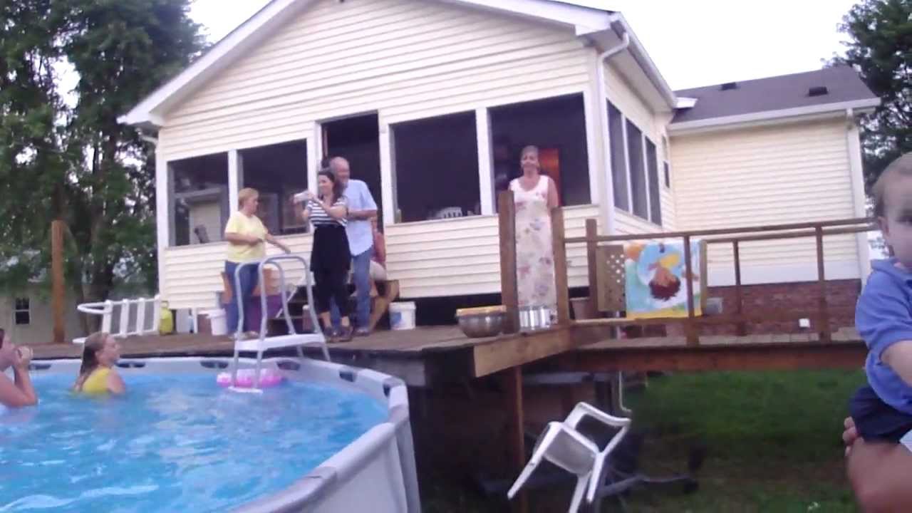 Bride jumps into pool after wedding ceremony - YouTube