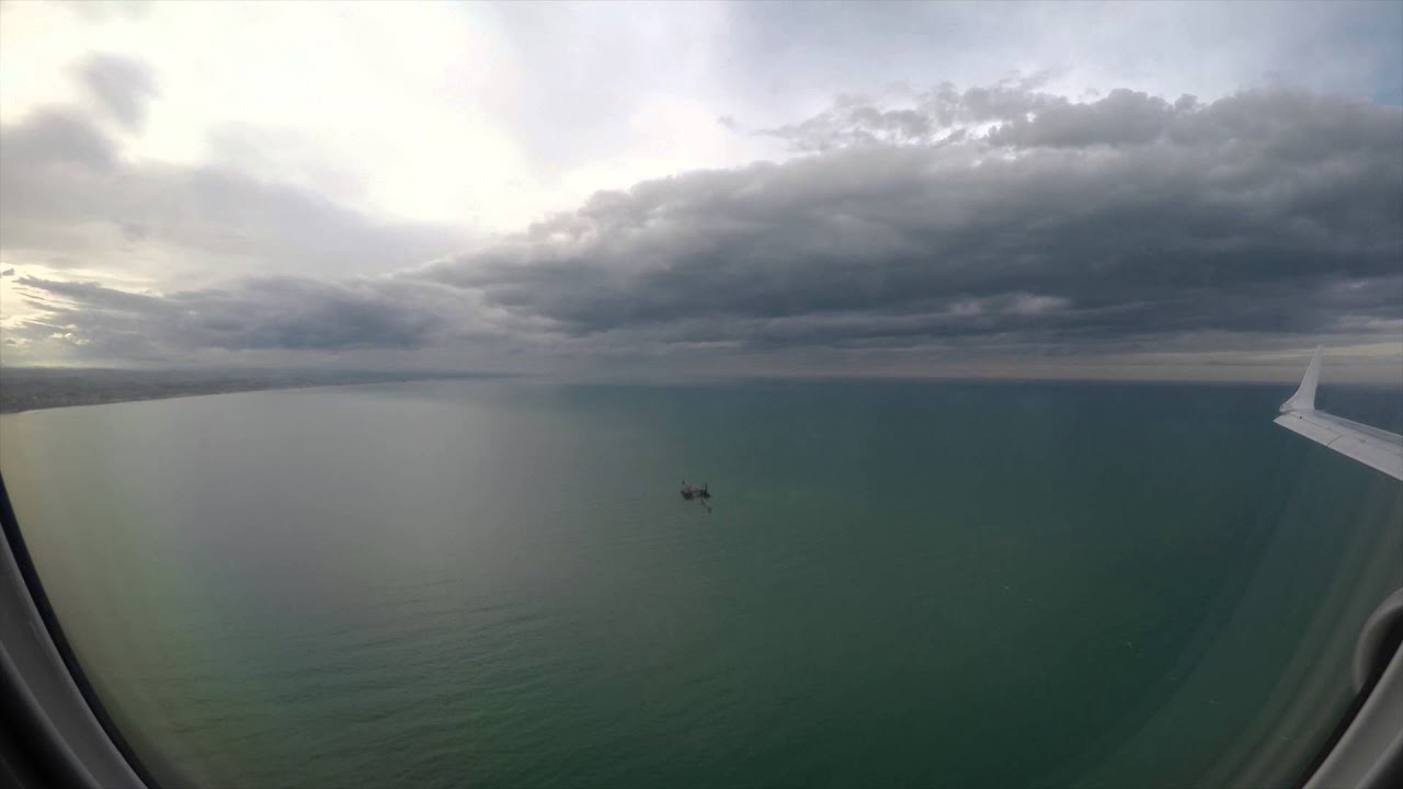 Lufthansa Embraer 195 landing over water at Ancona. Filmed with a goprp ...