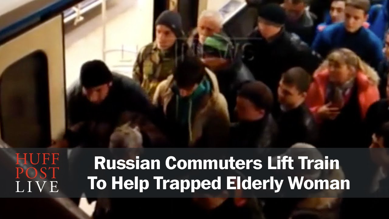 Russian Commuters Lift Train To Help Trapped Elderly Woman - YouTube