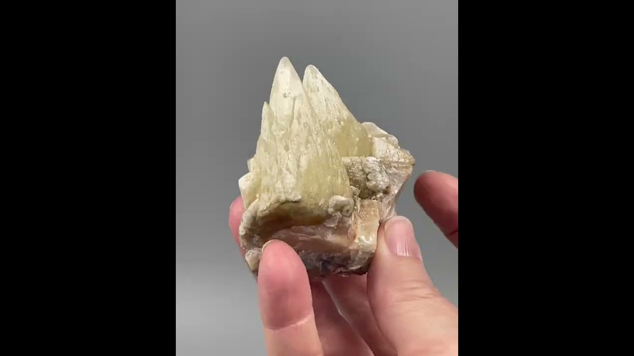 Scalenohedral “Dogtooth” Calcite with Gray Fluorite Near Base - YouTube