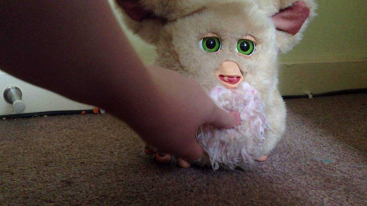 Furby is broken and doing the same things over and over again - YouTube