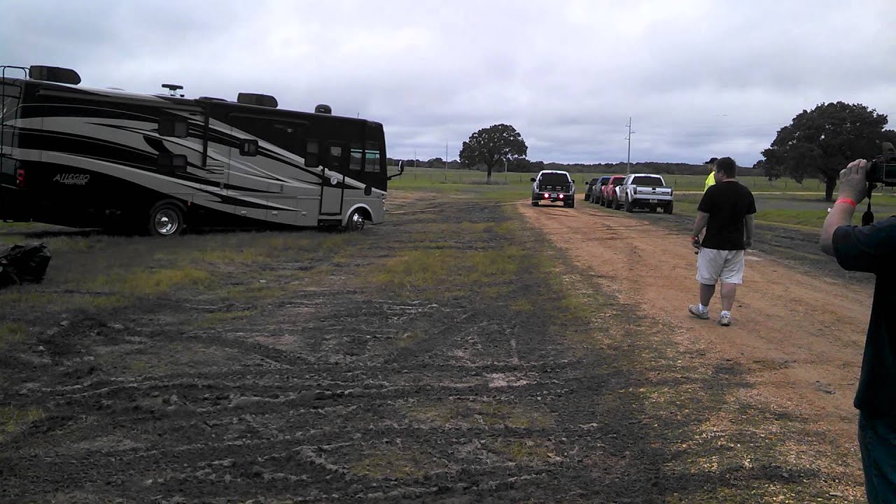 Ford Raptor pulling RV out of mud - YouTube