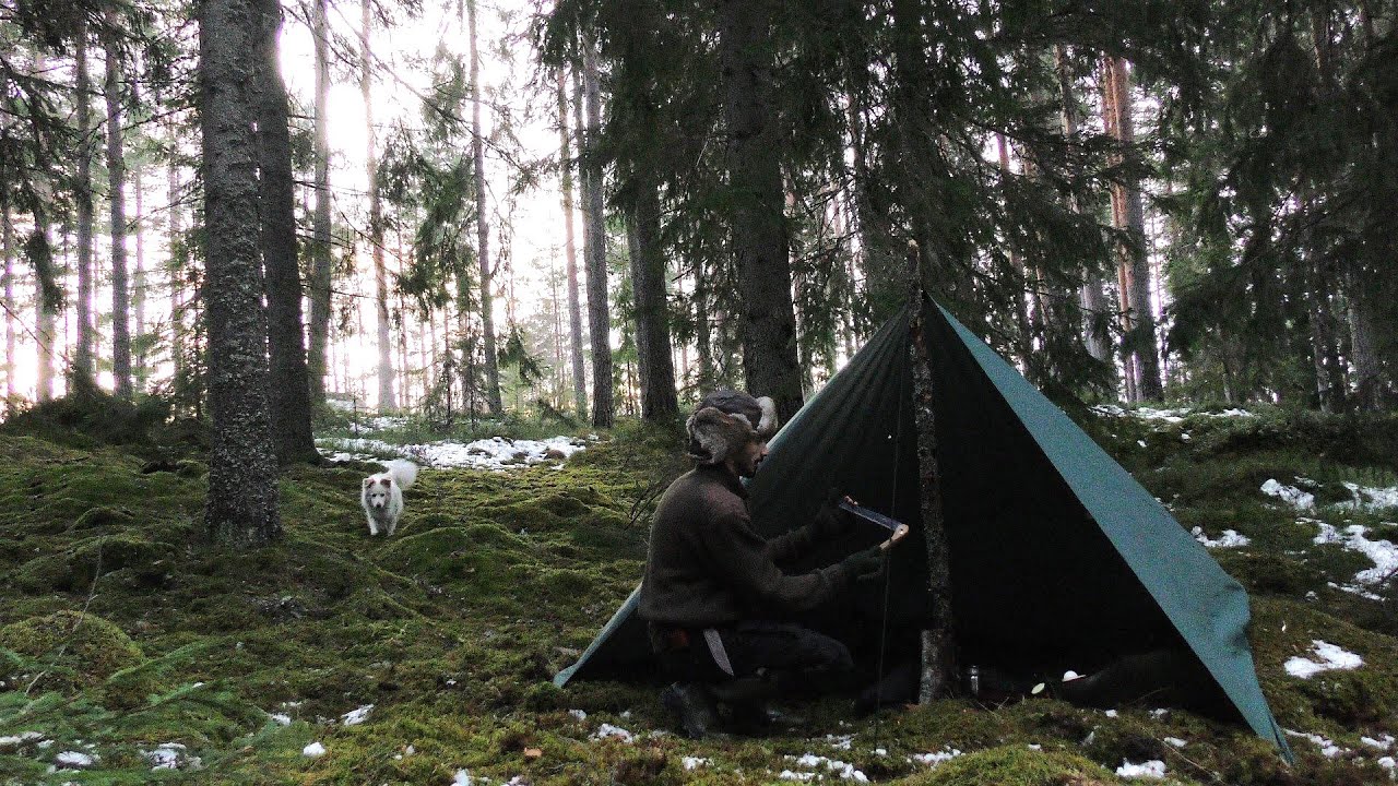 Bushcraft trip - tipi tarp setup, cooking, spruce tea, swedish axe and ...