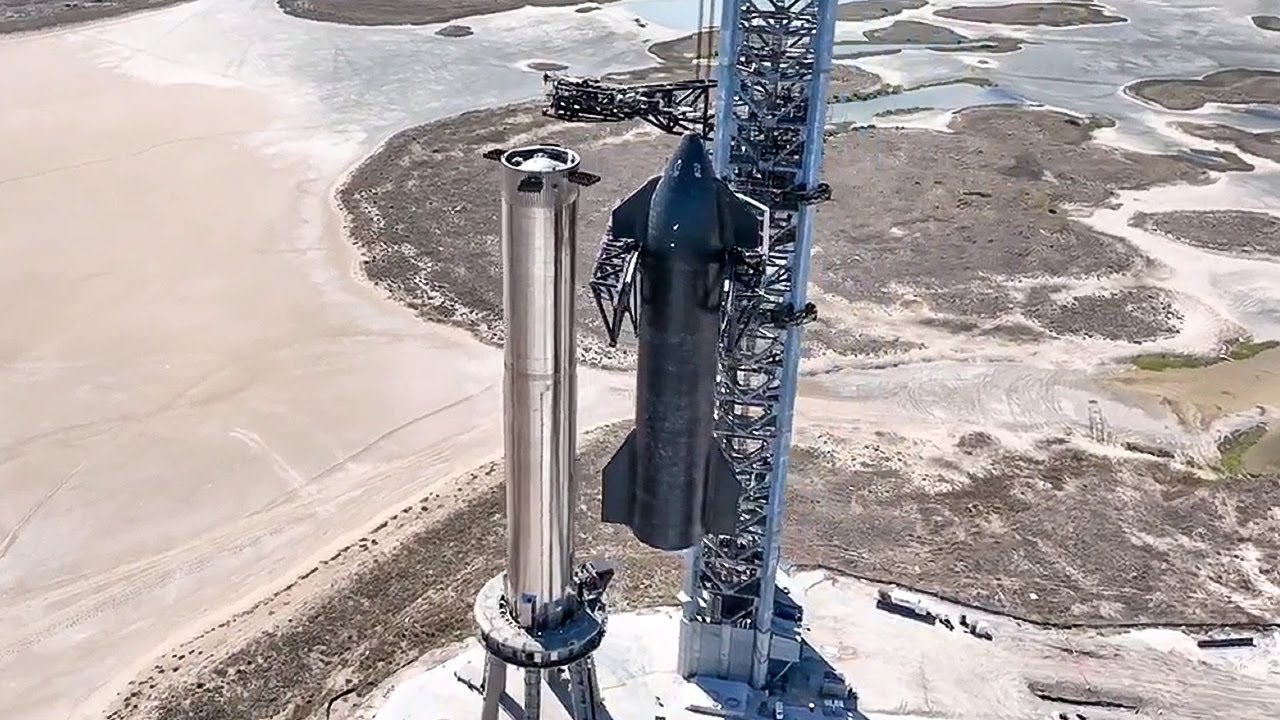 Launch and catch tower destacking and lowering Starship beside super ...