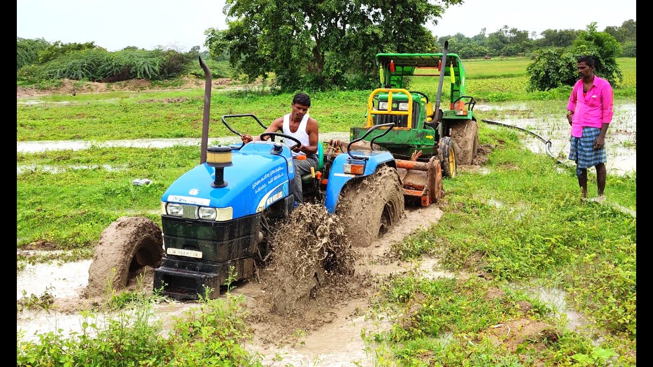 New holland and John Deere tractors stuck in mud Rescued by John Deere ...
