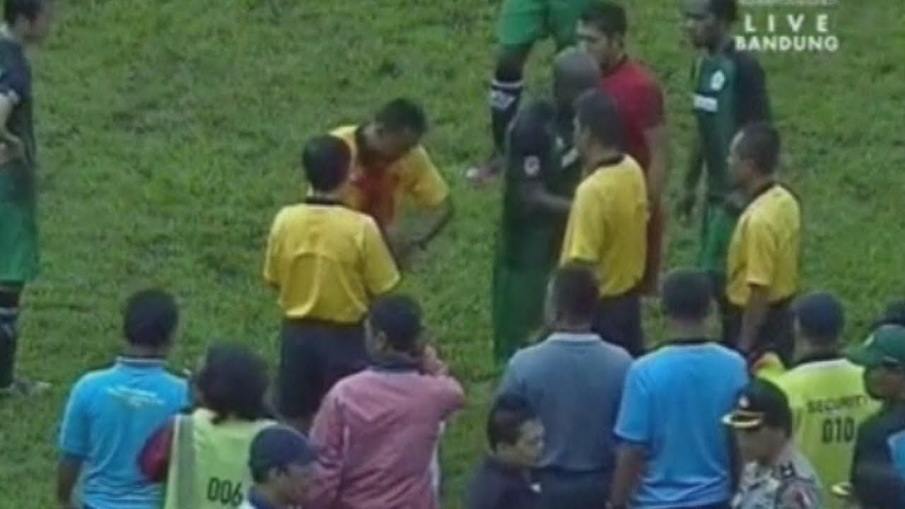 Indonesian football player draws blood after punching referee - YouTube