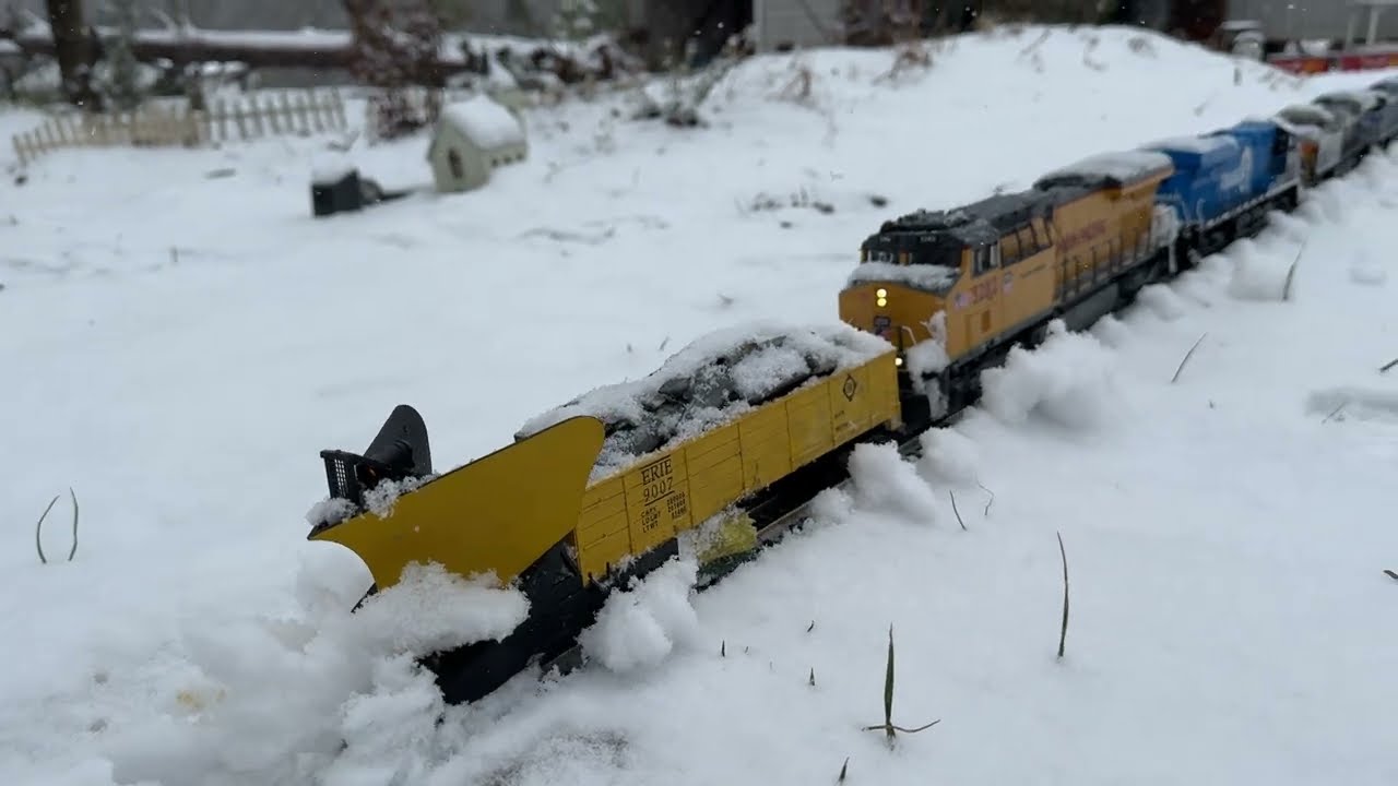 lionel legacy power plowing snow !! snow and train action - YouTube