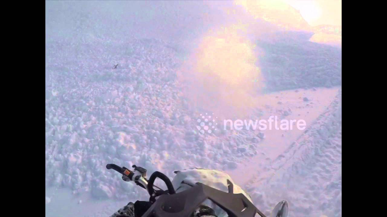 Snowmobile rider gets caught in avalanche in Canada - YouTube