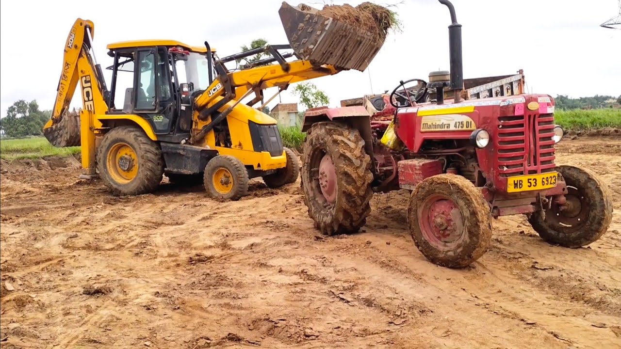 Jcb 3dx Eco Xcellence Machine Loading Mud In Mahindra 475 Di Tractor ...