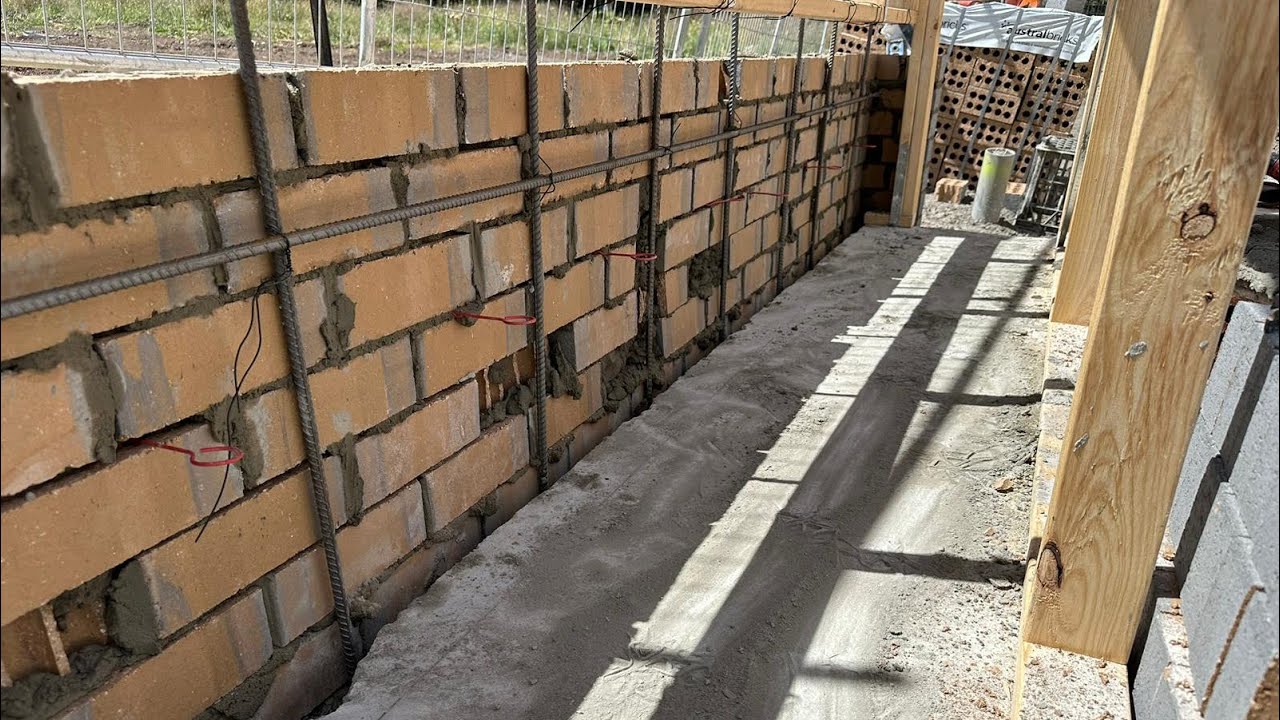 Core Filling a Garage Retaining Wall 🧱 - YouTube