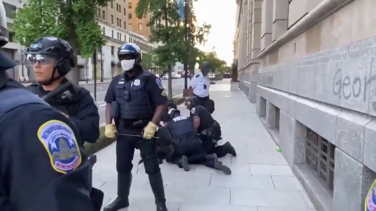Protesters hand rioter over to police - YouTube