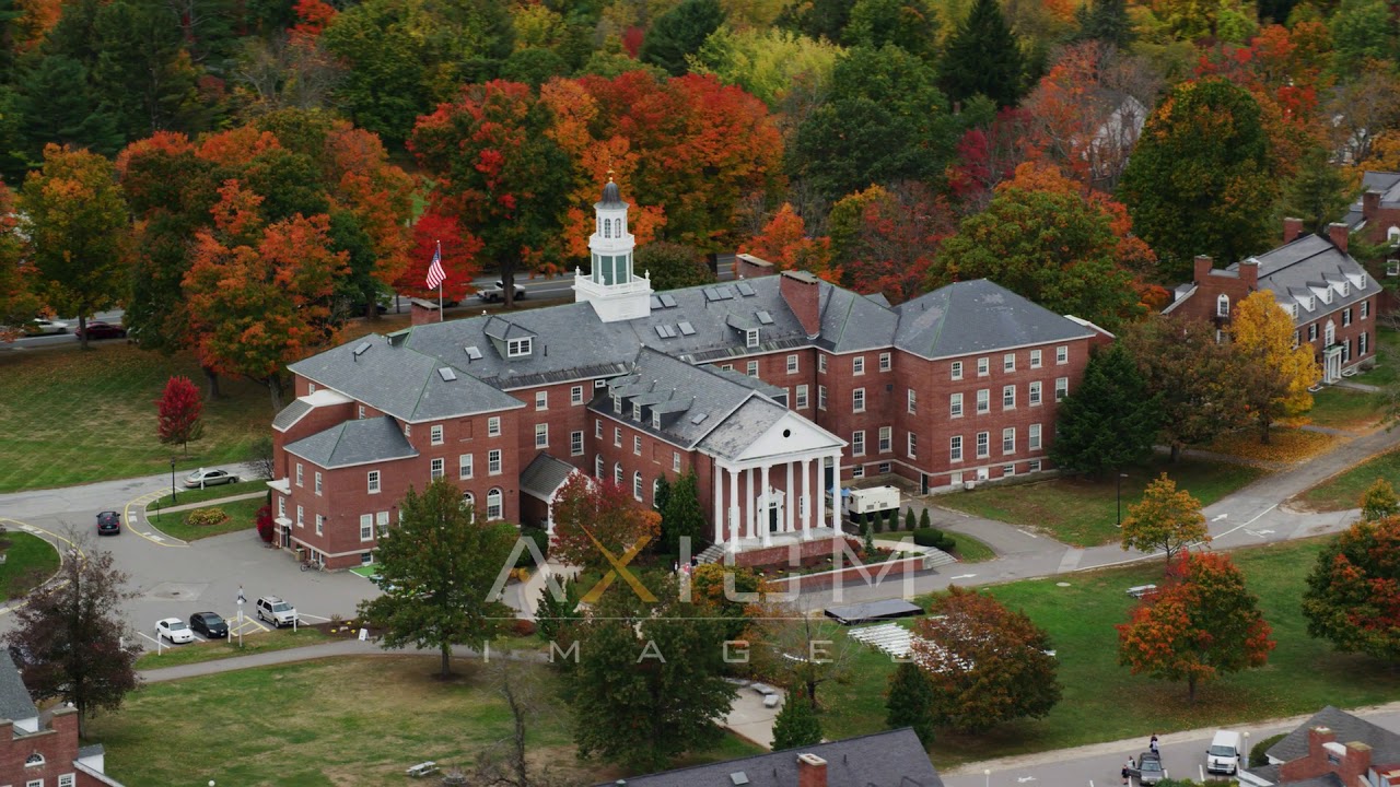 6K aerial video orbiting Colgate Hall, Colby Sawyer College, autumn ...