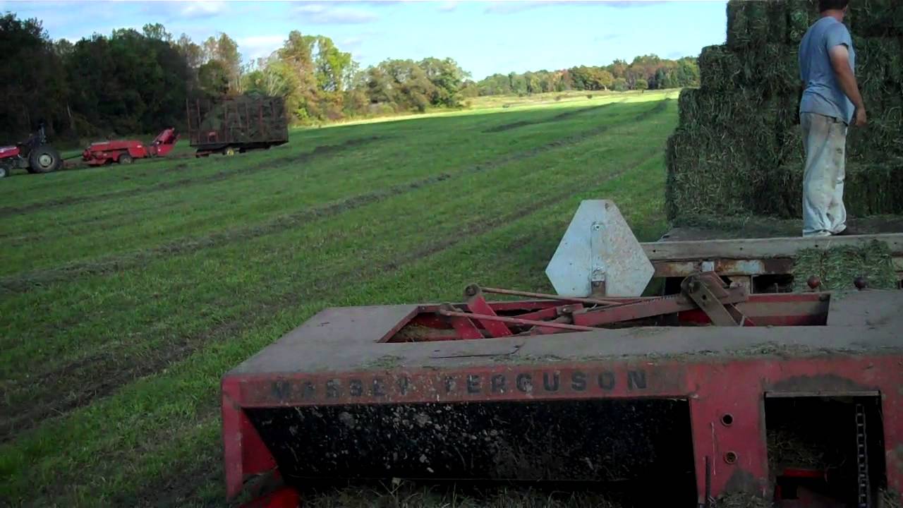 baling hay old school - YouTube