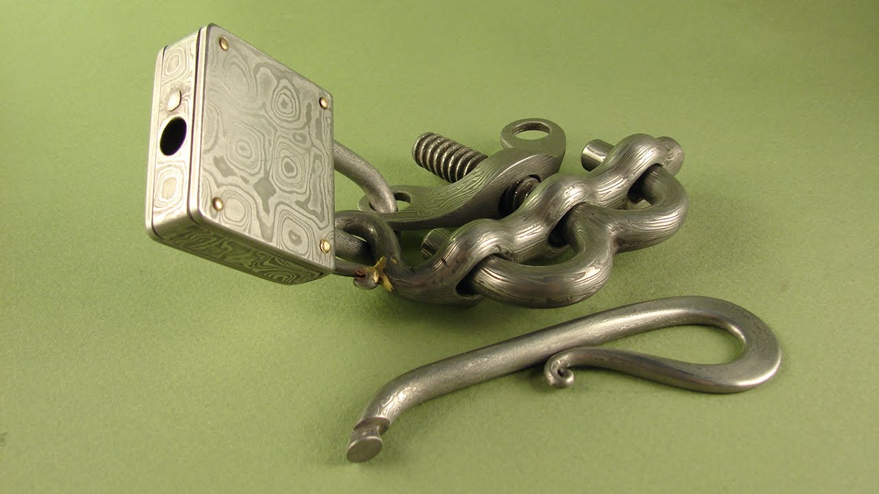 Damascus steel spring lock with thumbcuffs - YouTube