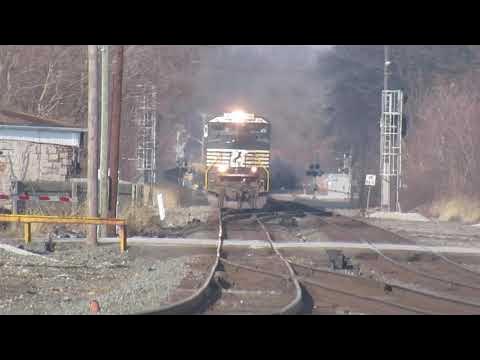 Norfolk Southern mix freight train with a BNSF trailing behind. In ...