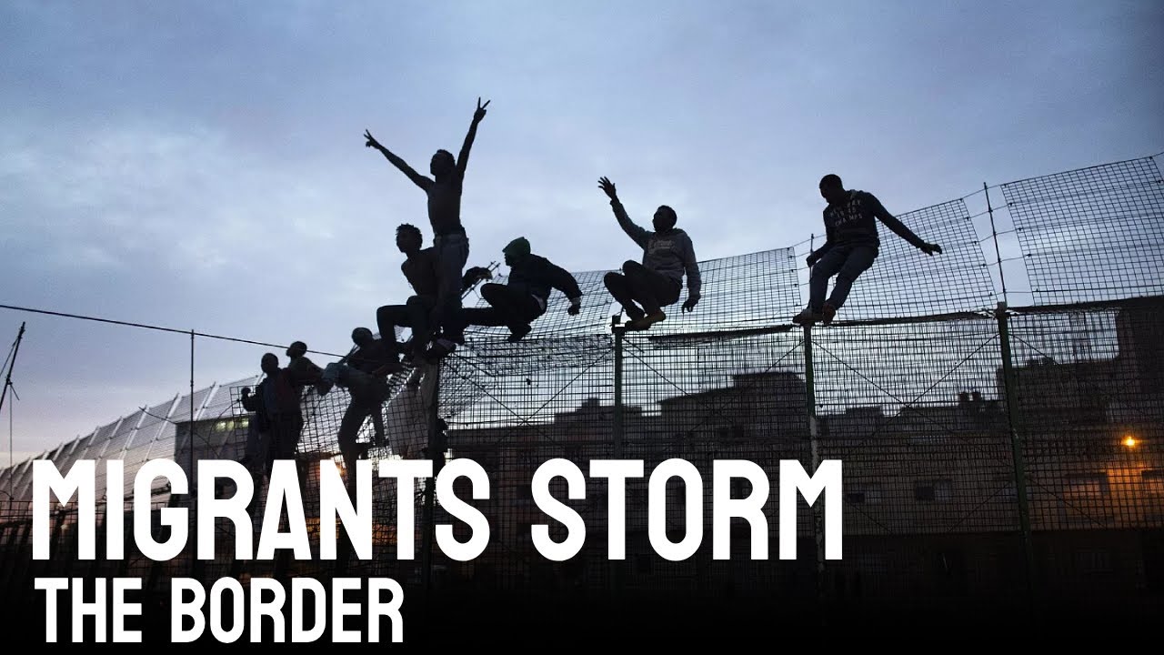Moroccans Storm Border Fence On Their Way To Spain! - YouTube