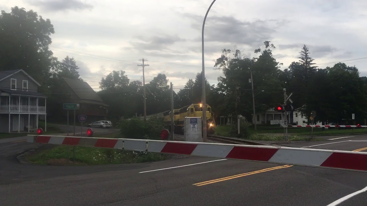 NYSW 3040 and 3018 lead a 15 car hopper train through Chenango Forks ...