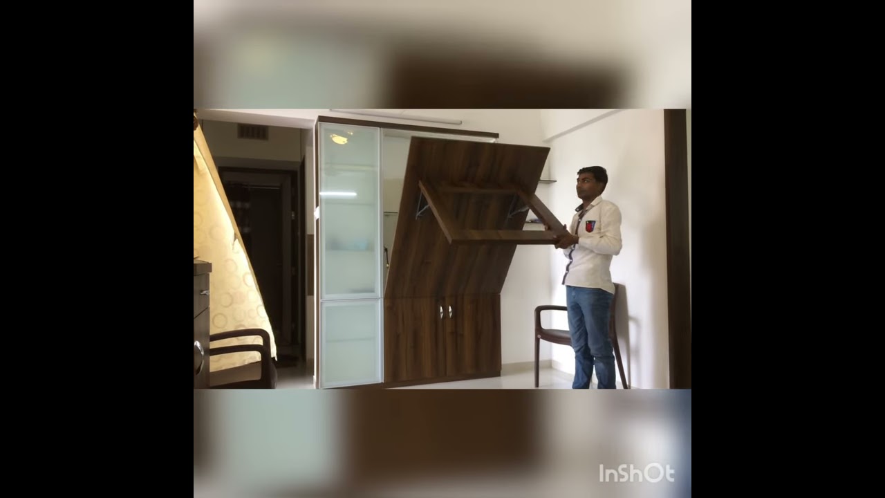 Crockery unit with folding dining table store