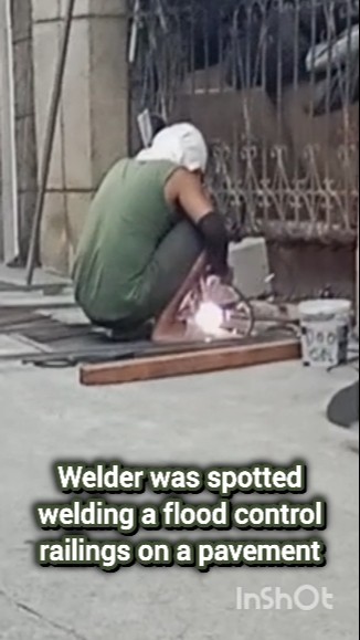 Welder was spotted welding a flood control railings in the pavement # ...