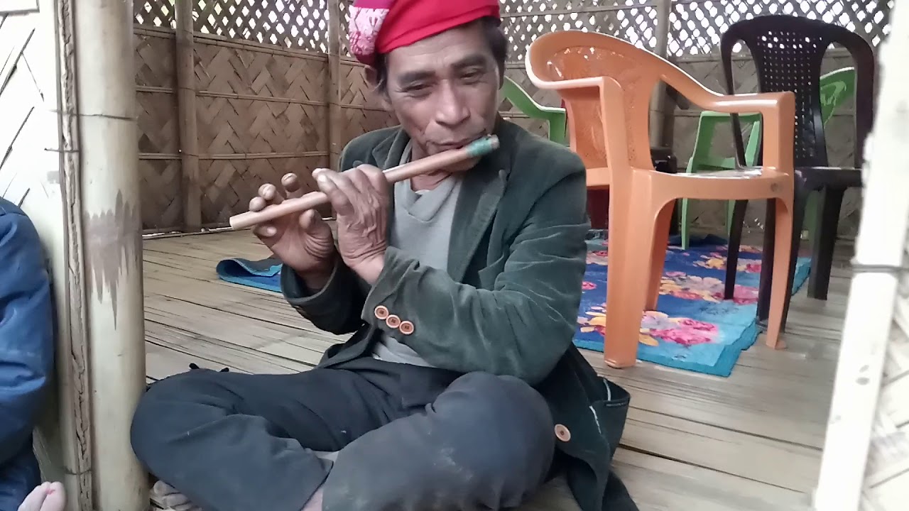 Karbi old man playing flute - YouTube