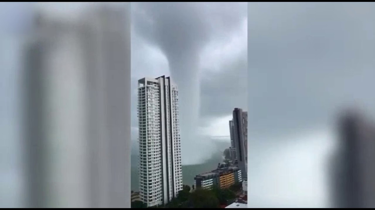 Footage captures mega water spout dwarfing high-rise building - YouTube