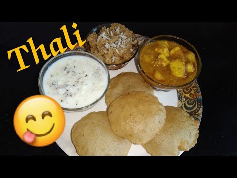 Veg thali -poori kheer aloo panner ki sabji.Halwa . Indian veg thali 🤤 ...