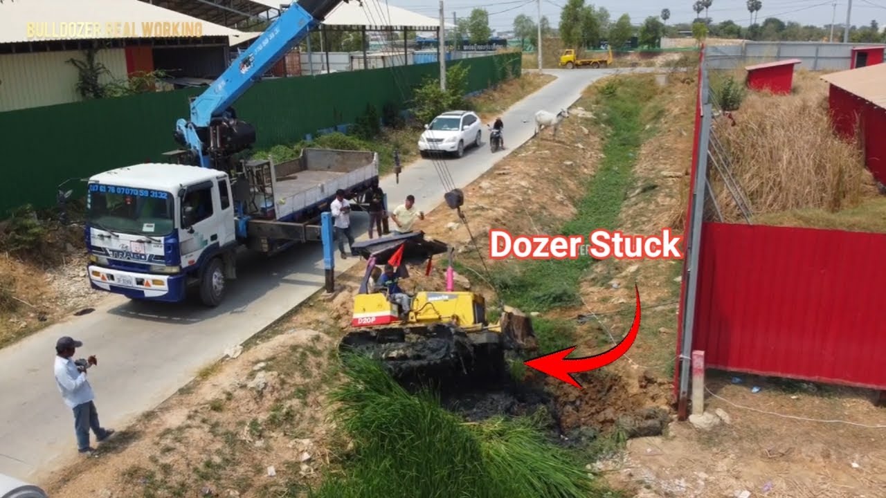 Dozer Stuck , crashes into ditch - YouTube