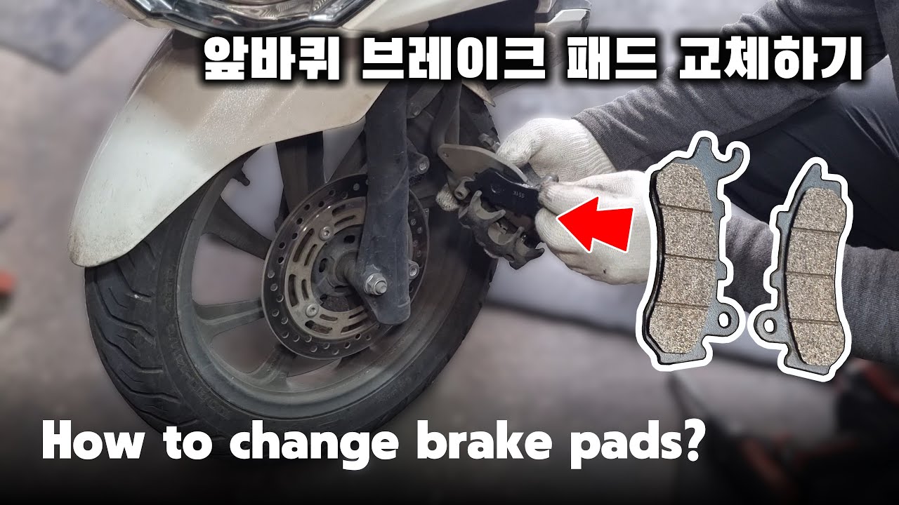 Honda PCX 125 motorcycle front wheel brake pad change - YouTube
