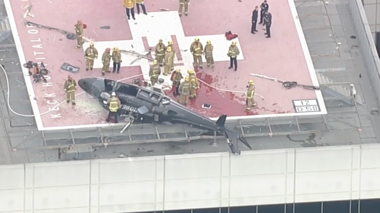 AIR7 over scene of "down" helicopter at USC-County Hospital helipad ...
