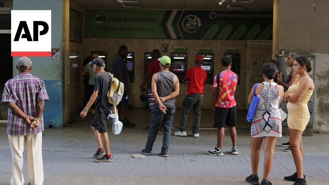 Cuba's cash shortage causes long lines at banks and ATMs - YouTube