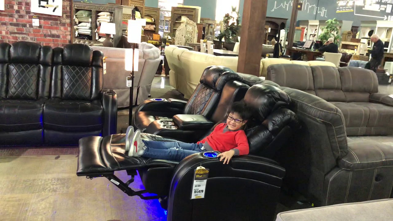 TinTin is playing with the power reclining sofa - YouTube