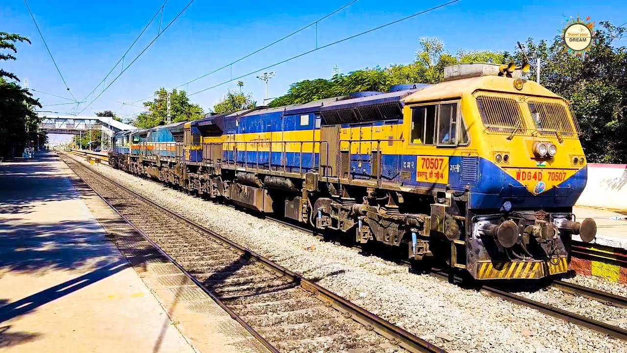 Twin EMD locomotives paired with an Alco locomotive, cruising together ...