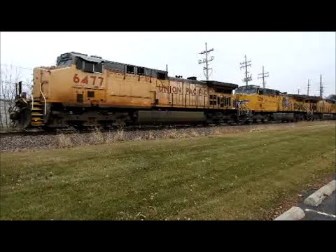 UP 6477 a C44AC leads a manifest west through Geneva IL - YouTube