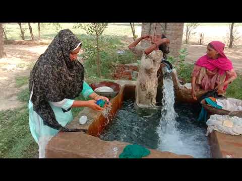 washing clothes in village tube well - daily routine working - Punjab ...