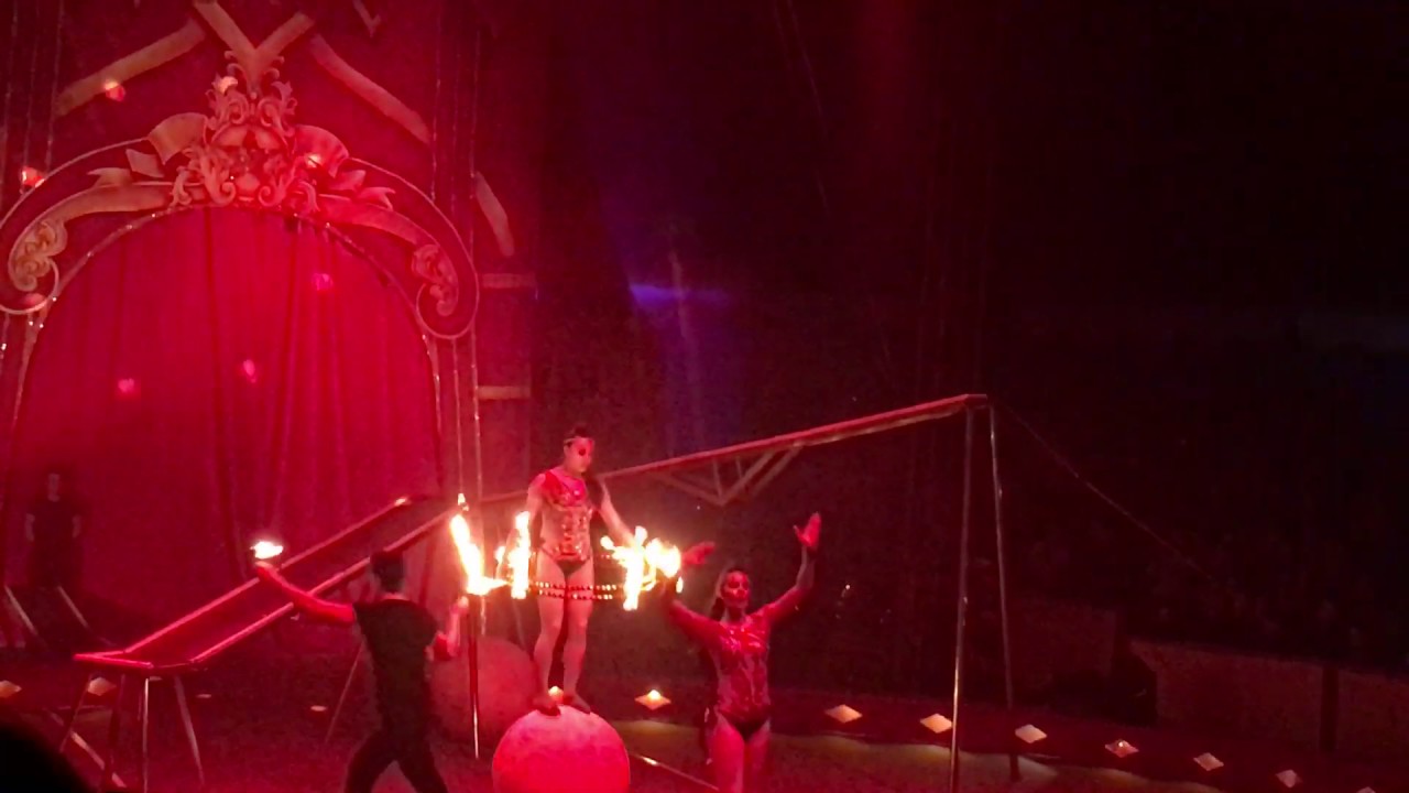 Gandeys Circus balance ball with fire hoops - YouTube