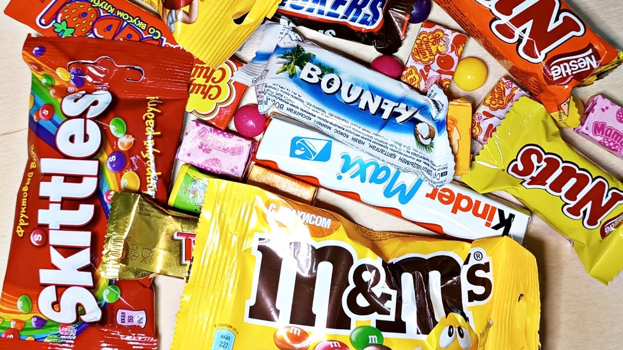 Unpacking now a small chocolate candy with filling - YouTube