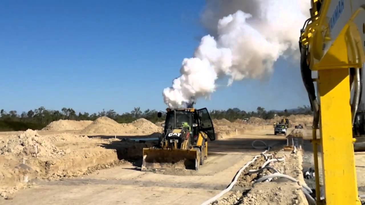 smoking cat backhoe dies - YouTube