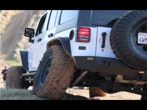 White Jeep goes off-roading and almost tips over - YouTube