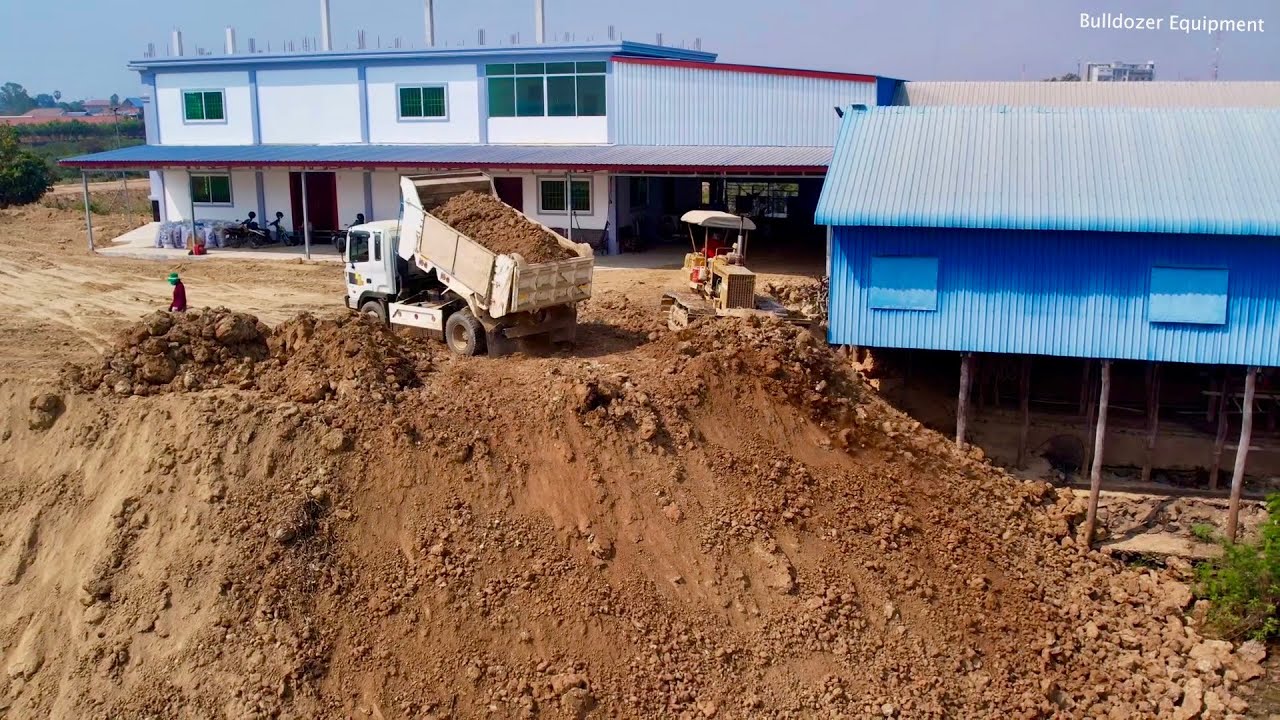 Video of Pouring Soil clearing Water near the house and clearing gaps ...