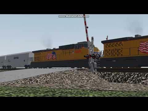 UP 6608 Departs after flagging crossing - YouTube