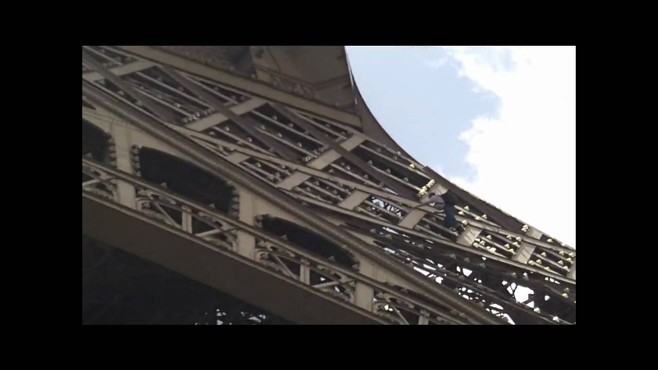 Man Climbs Eiffel Tower - YouTube